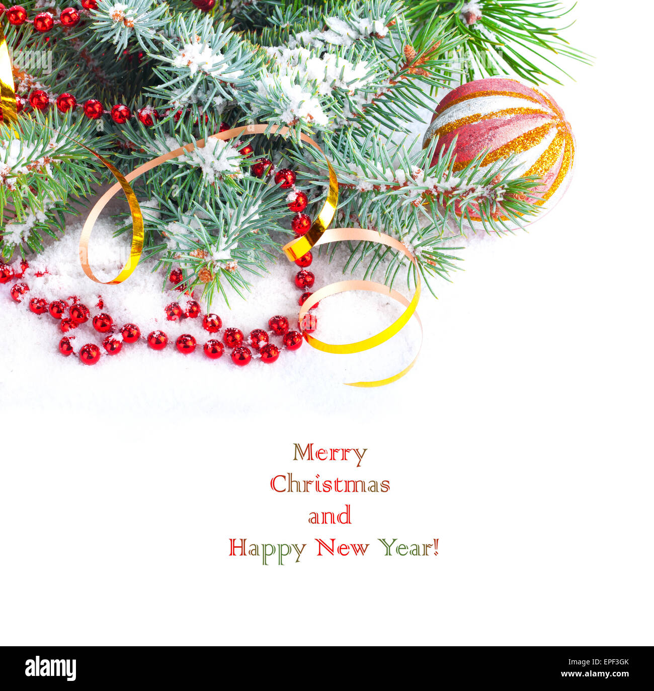 Christmas tree branch with gold serpentine and red sphere on white ...