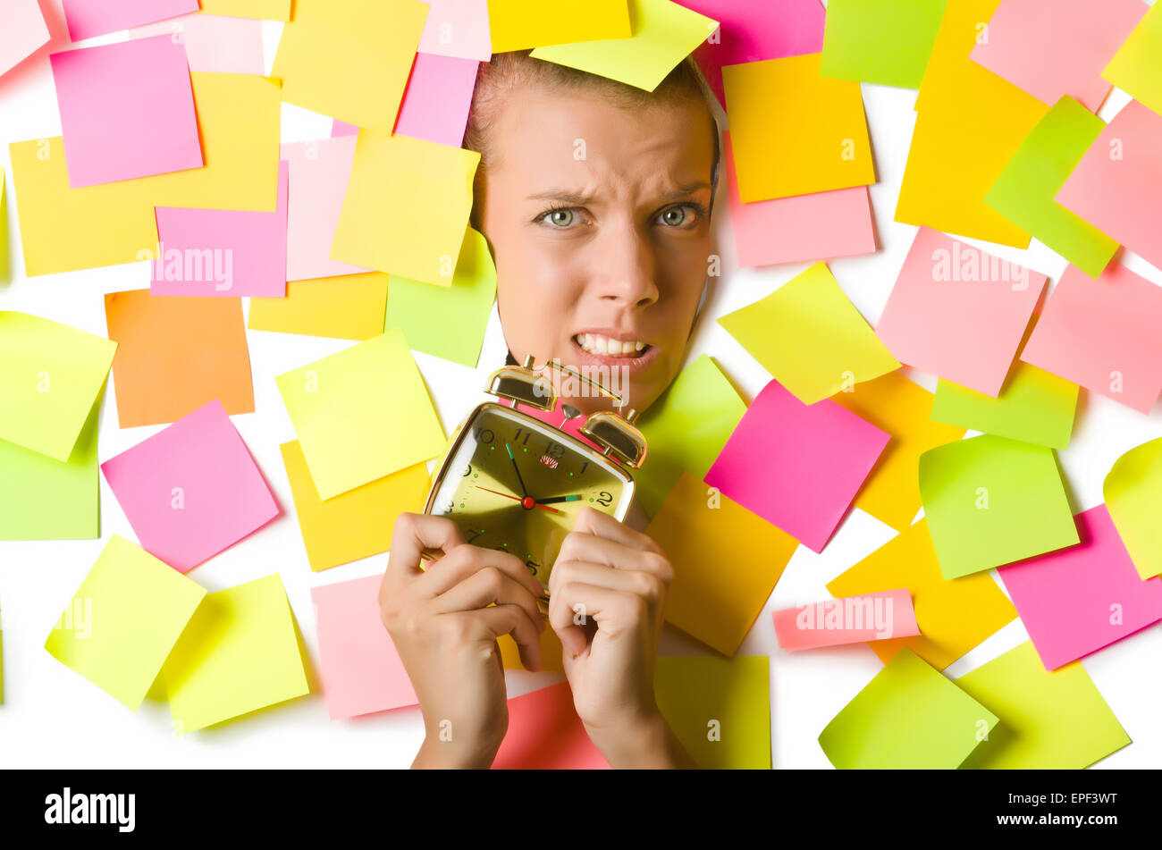 Woman with clock and lots of reminders Stock Photo - Alamy