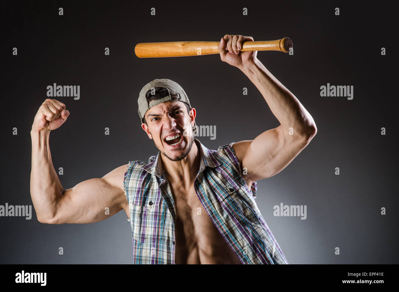 Violent man with baseball bat and hat Stock Photo - Alamy