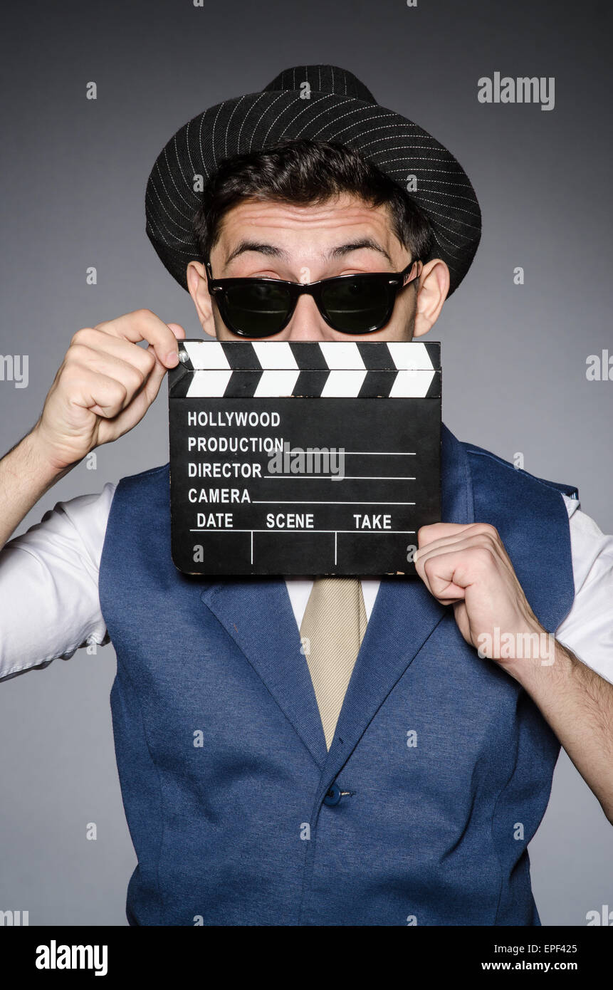 Funny man with movie clapper Stock Photo - Alamy