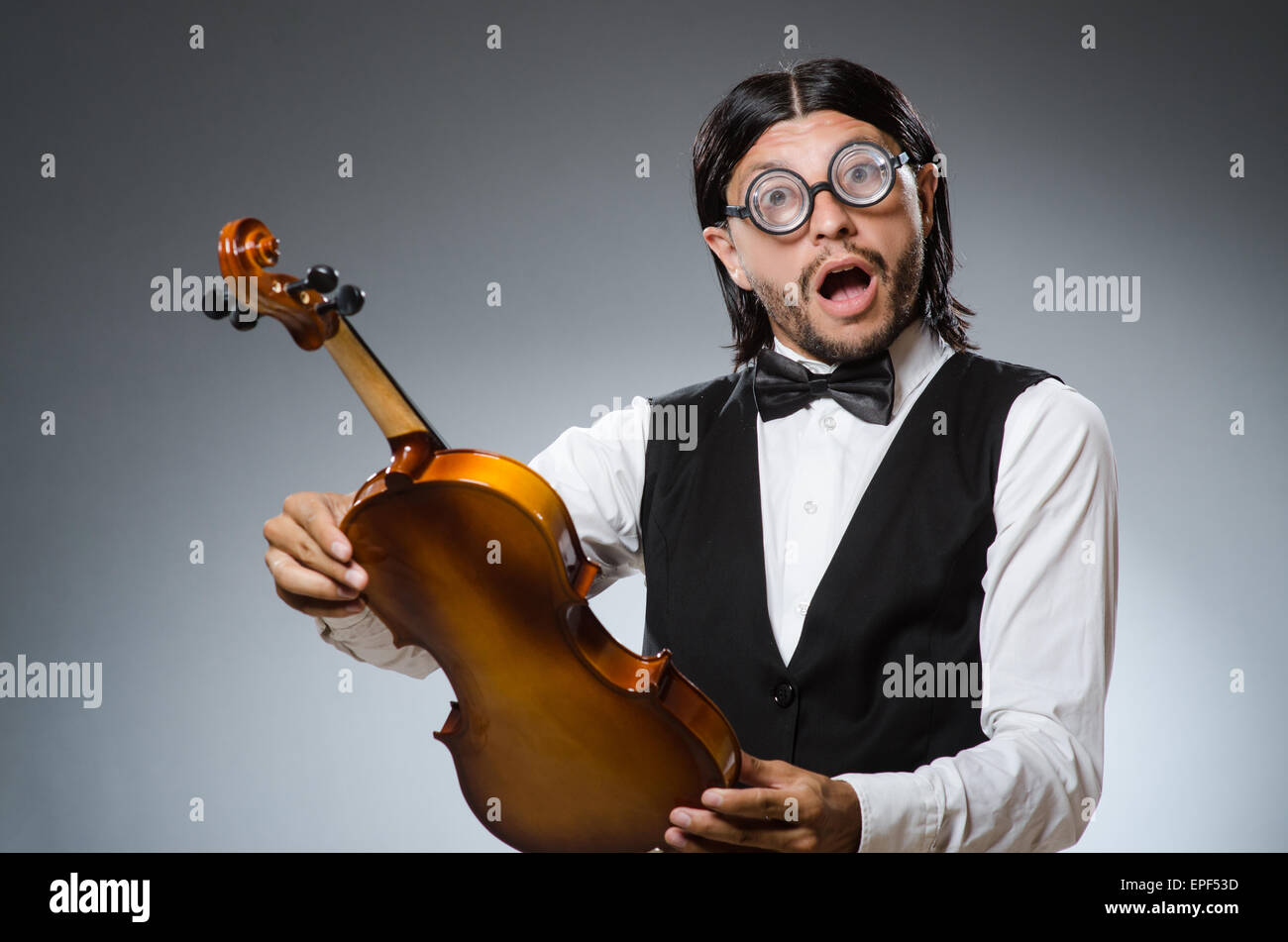 Funny fiddle violin player in musical concept Stock Photo - Alamy
