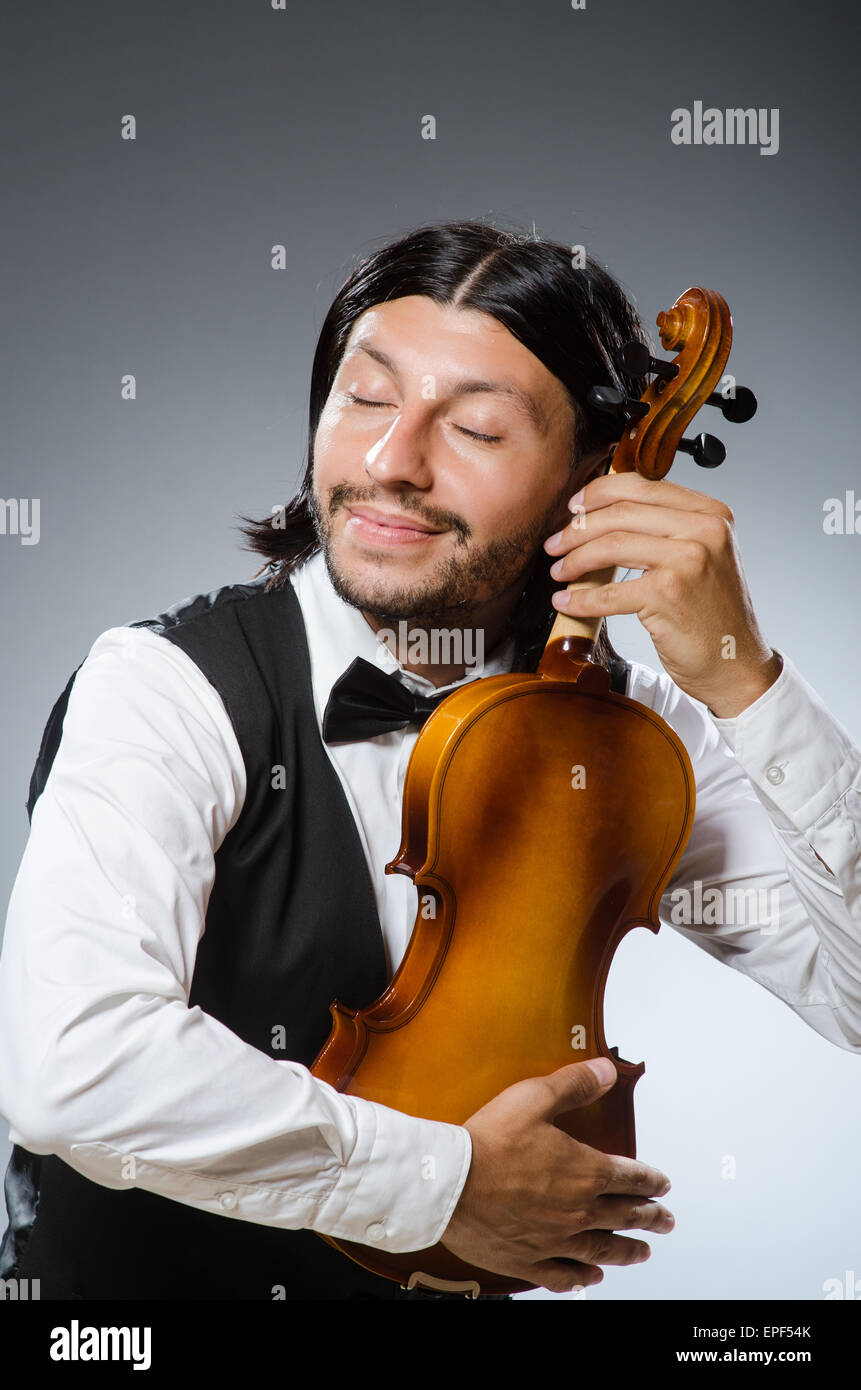 Funny fiddle violin player in musical concept Stock Photo - Alamy