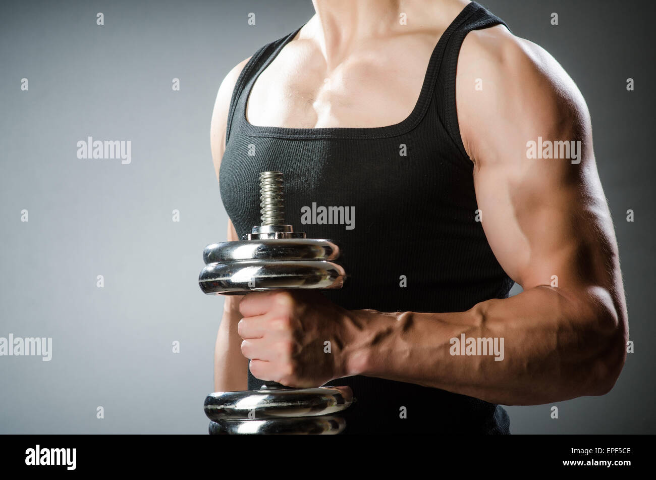 Muscular ripped bodybuilder with dumbbells Stock Photo - Alamy