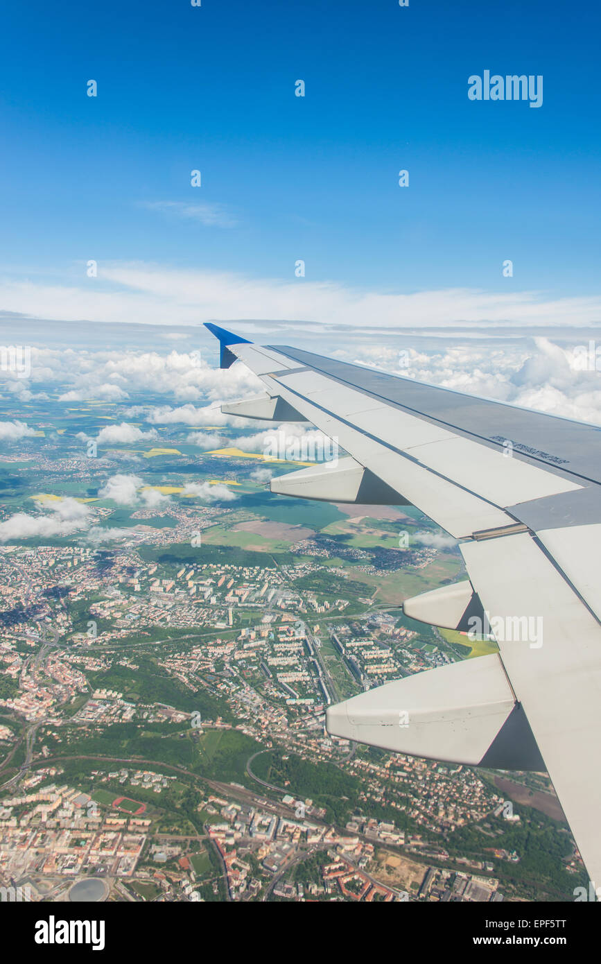 Airplane wing out of window Stock Photo - Alamy