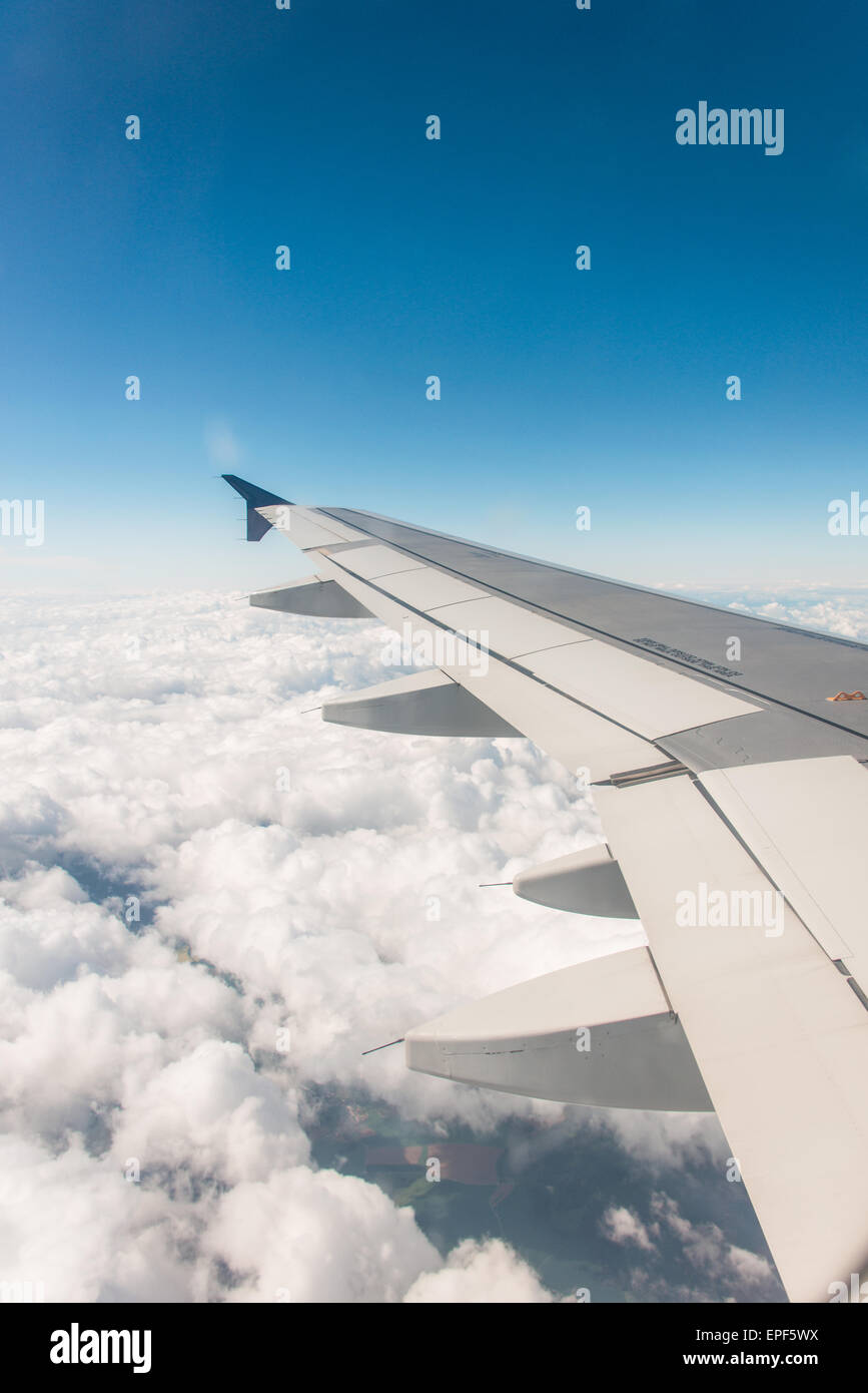 Airplane wing out of window Stock Photo - Alamy