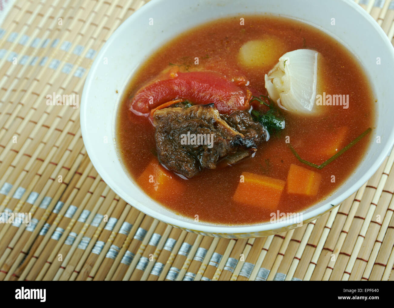 shurpa chaban - Uzbek cuisine . lamb soup with tomatoes Stock Photo - Alamy