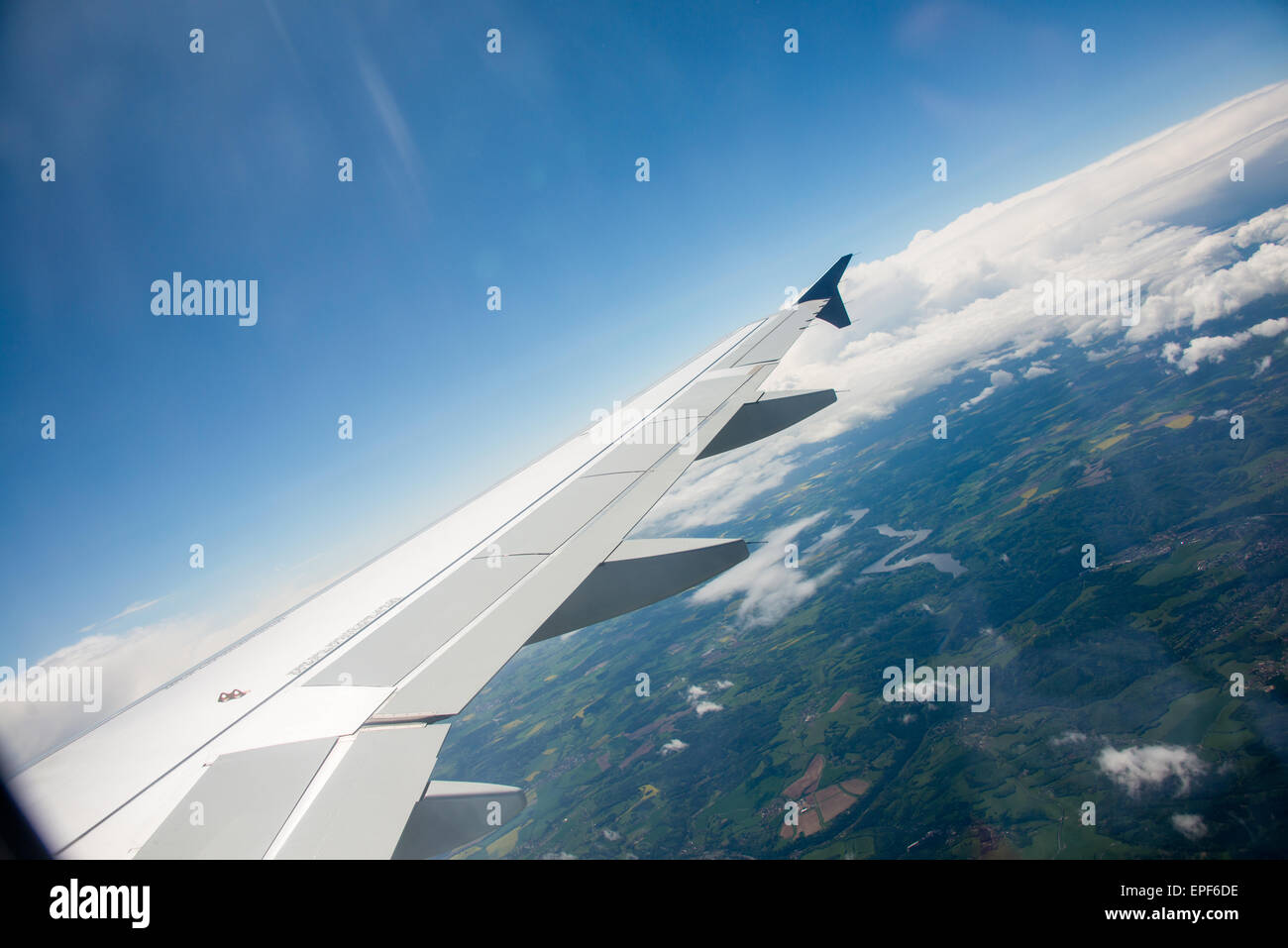 Airplane wing out of window Stock Photo - Alamy