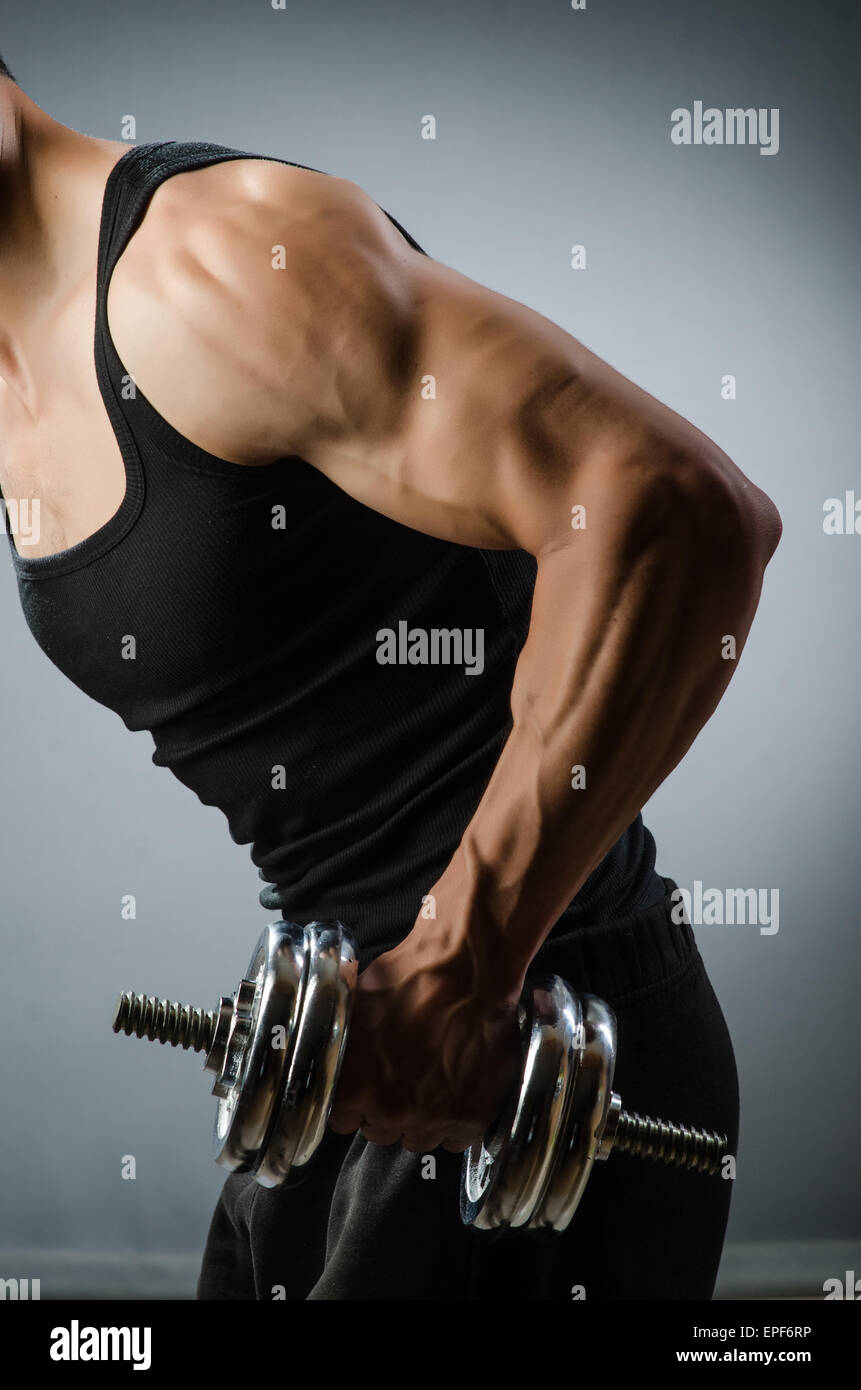 Muscular ripped bodybuilder with dumbbells Stock Photo - Alamy