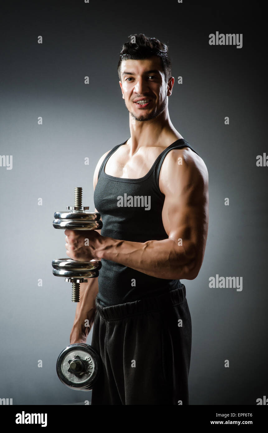 Muscular ripped bodybuilder with dumbbells Stock Photo - Alamy