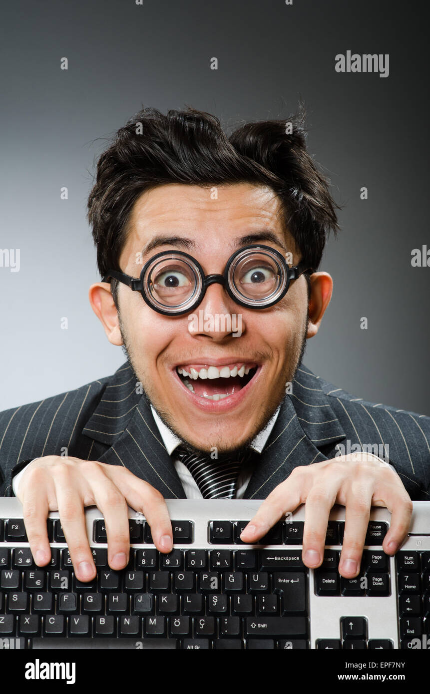 Comouter geek with computer keyboard Stock Photo - Alamy