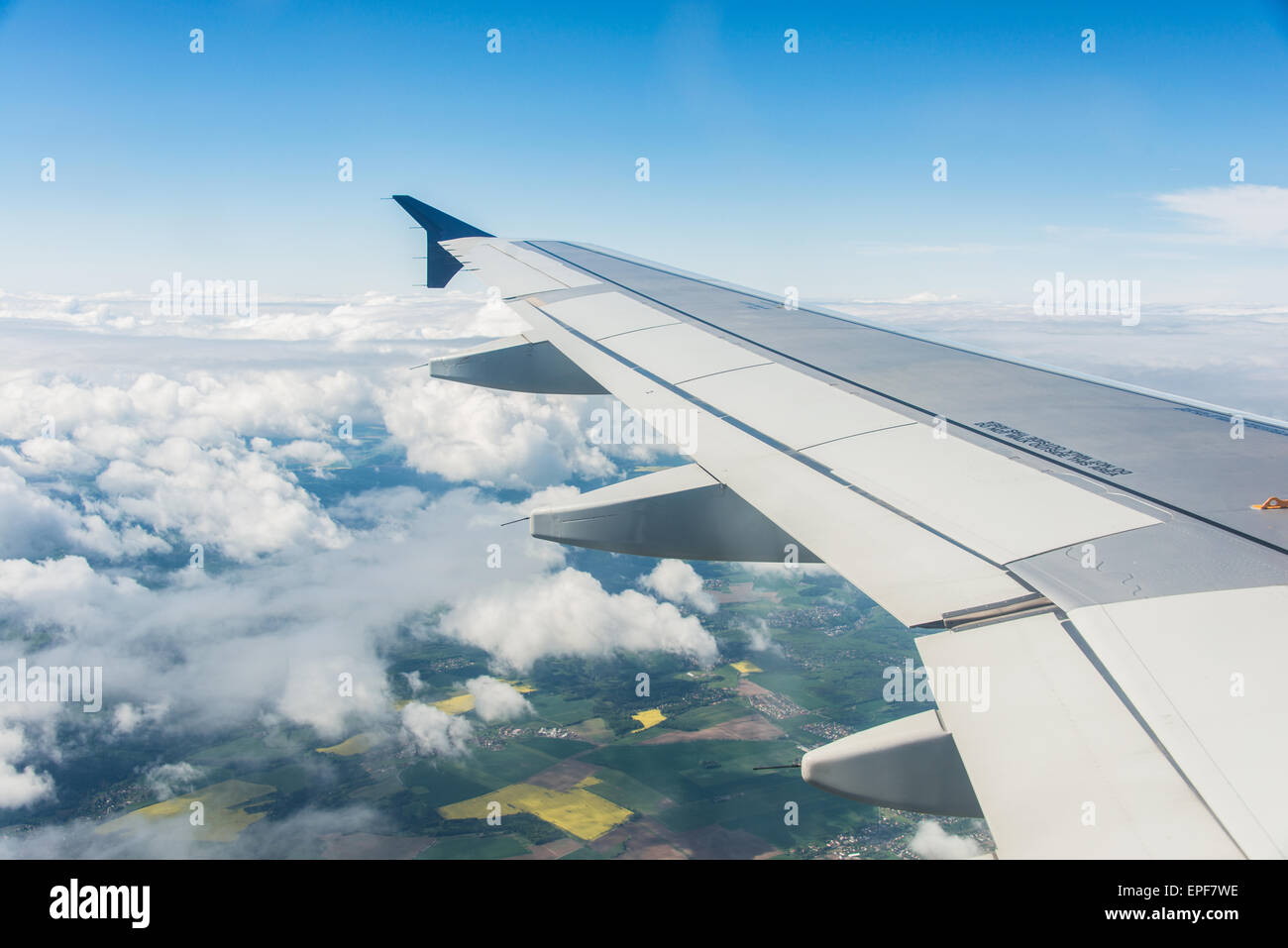 Airplane wing out of window Stock Photo - Alamy