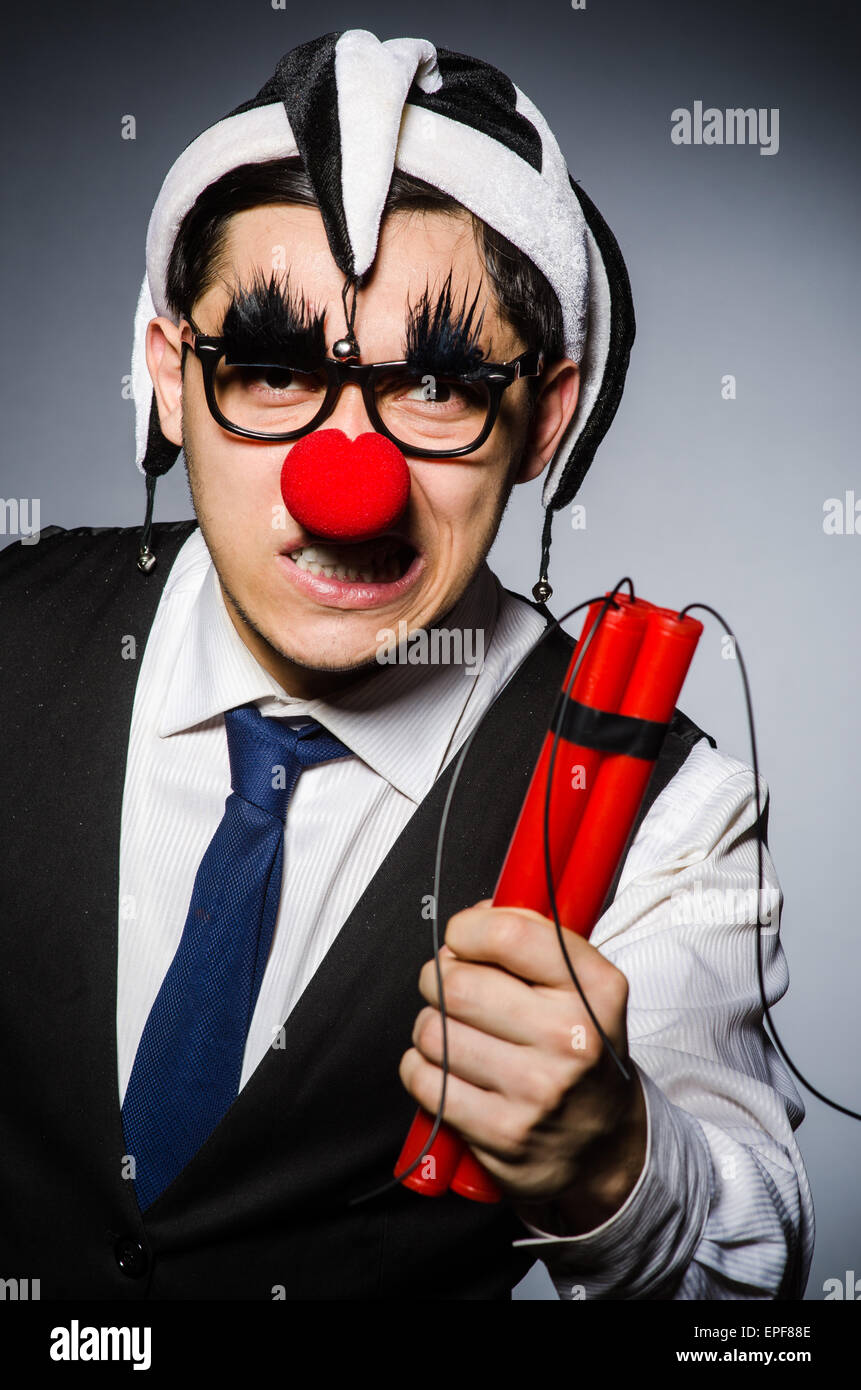 Funny clown with sticks of dynamite Stock Photo - Alamy
