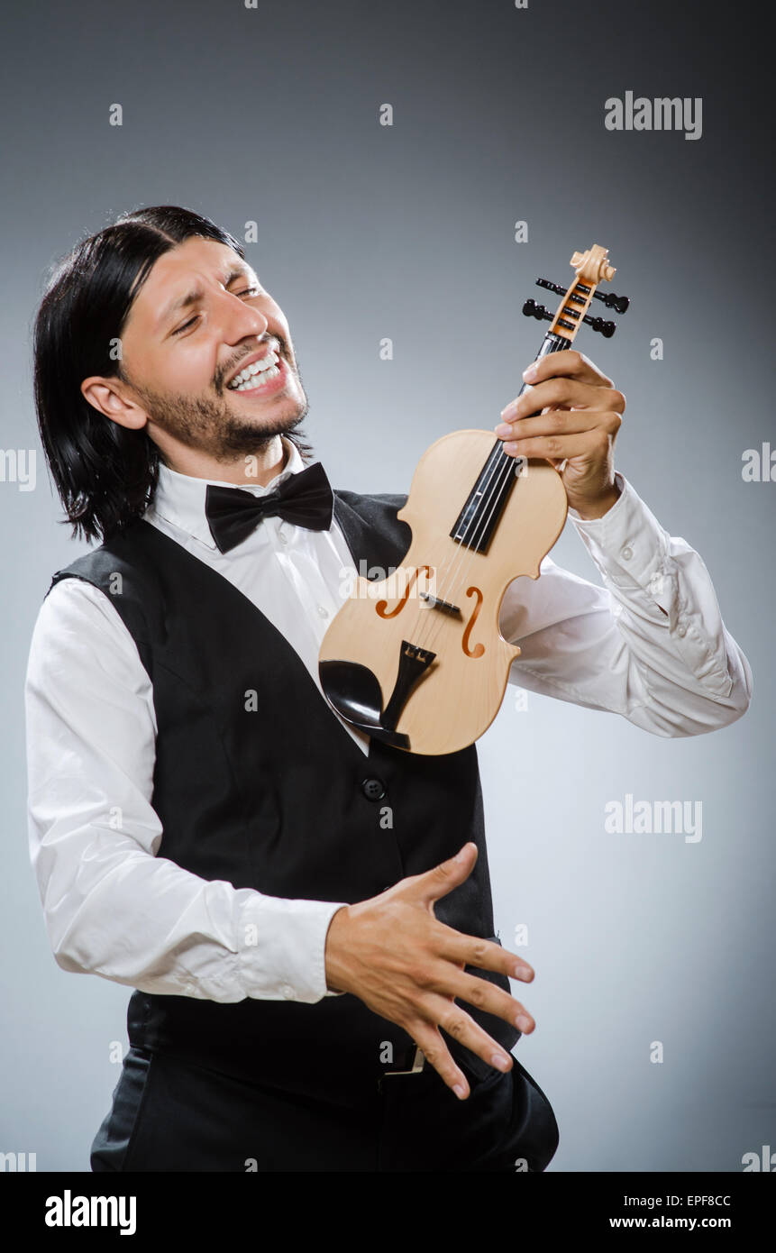 Funny fiddle violin player in musical concept Stock Photo - Alamy
