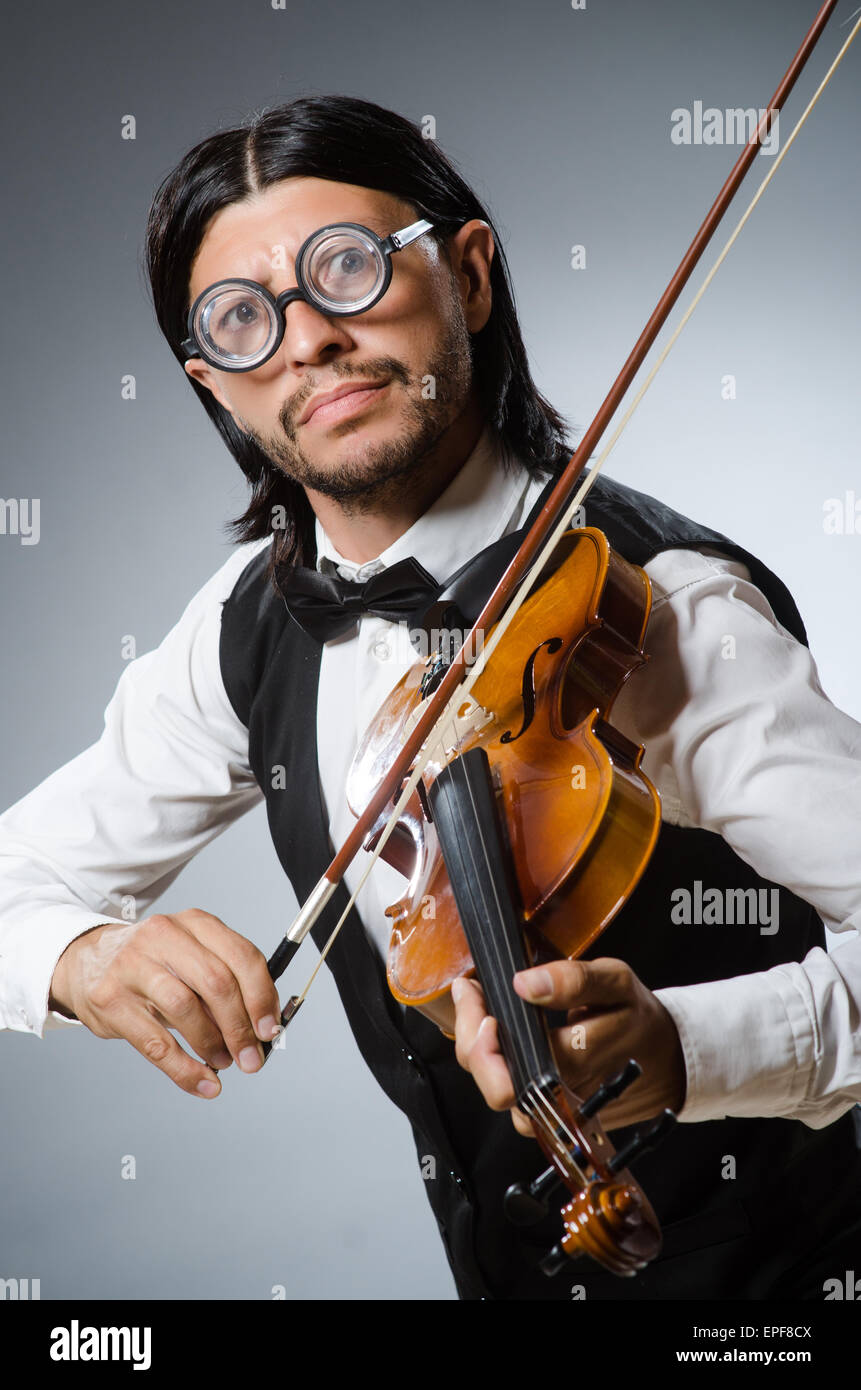 Funny fiddle violin player in musical concept Stock Photo - Alamy