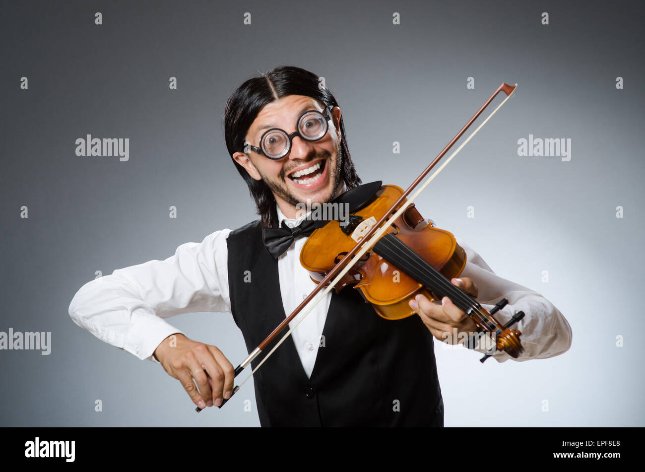 Funny fiddle violin player in musical concept Stock Photo - Alamy