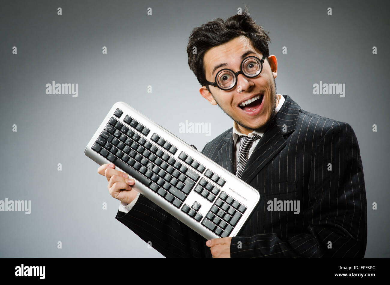 Comouter geek with computer keyboard Stock Photo - Alamy