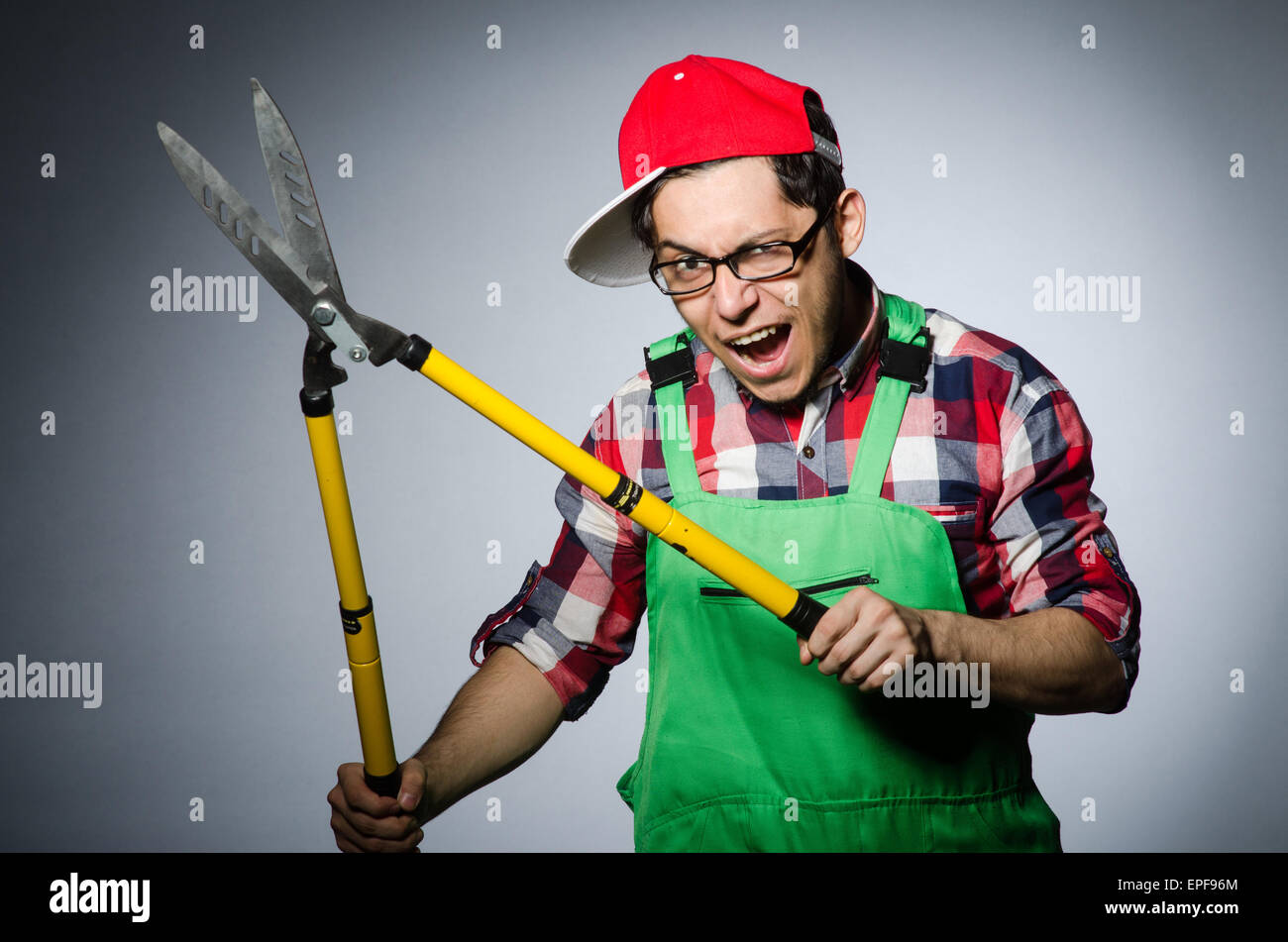 Funny man with giant shears Stock Photo - Alamy