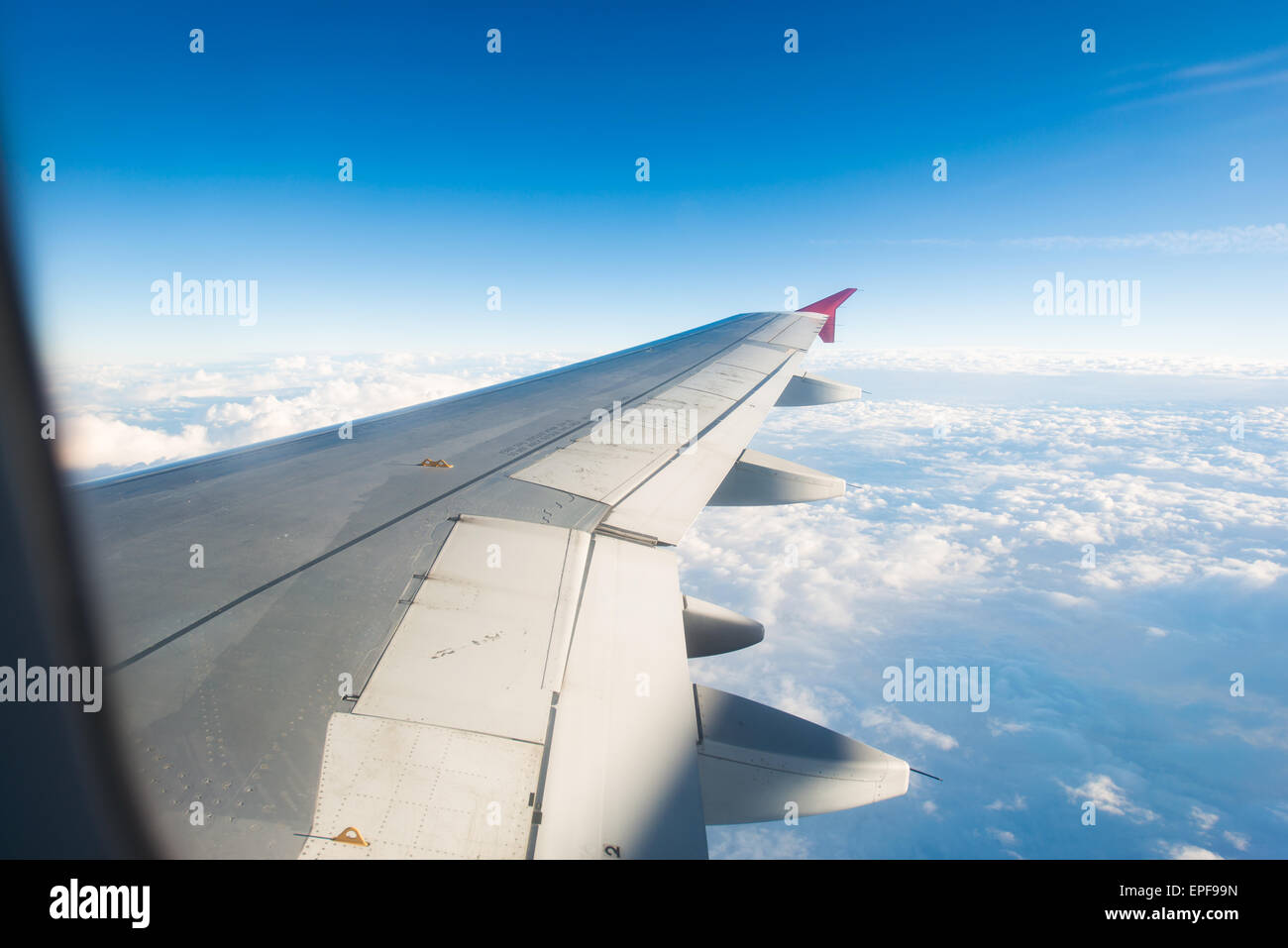 Airplane wing out of window Stock Photo - Alamy