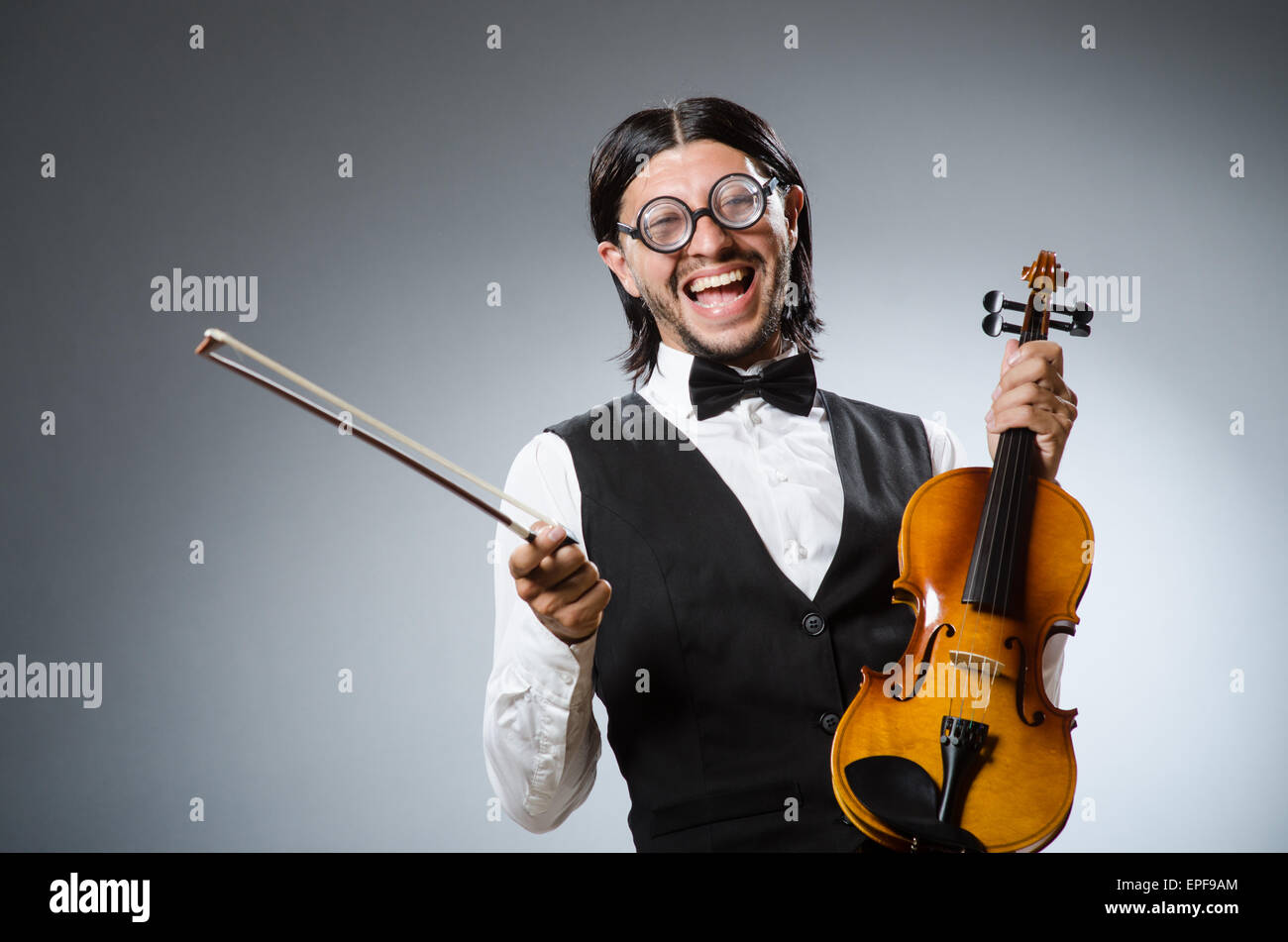 Funny fiddle violin player in musical concept Stock Photo - Alamy
