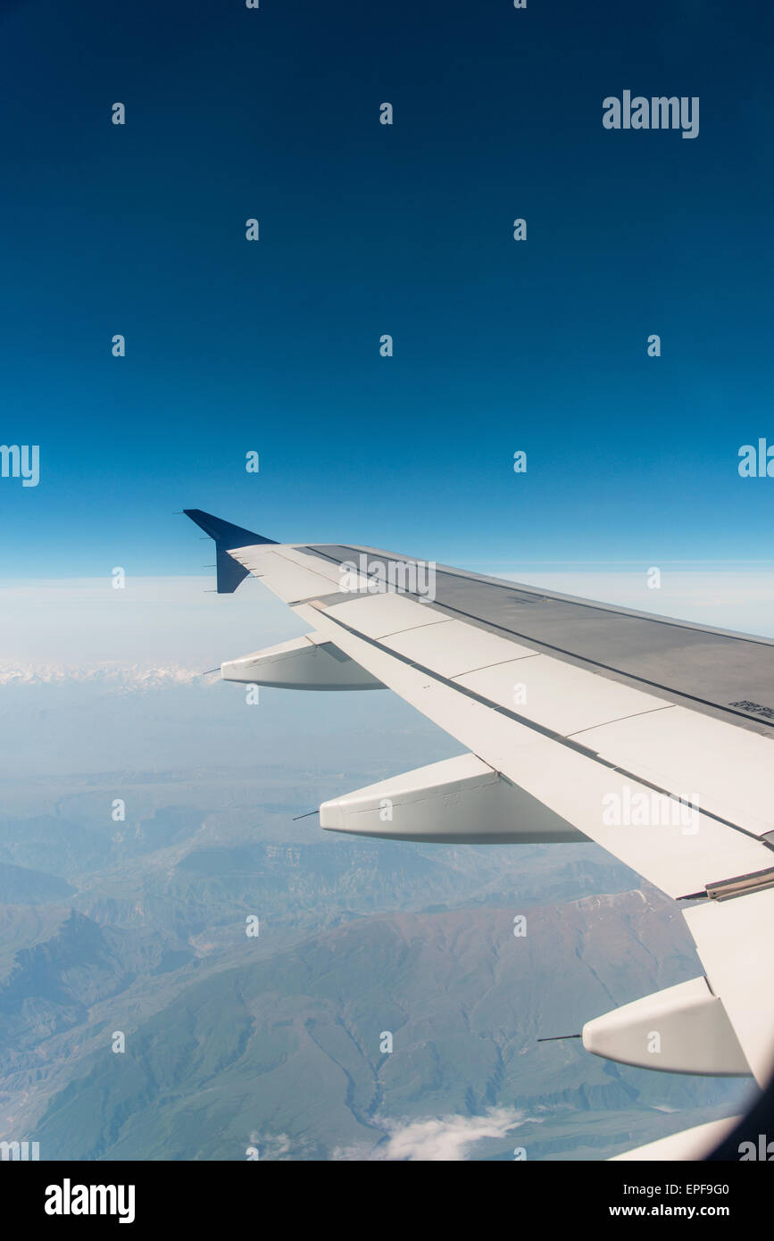 Airplane wing out of window Stock Photo - Alamy