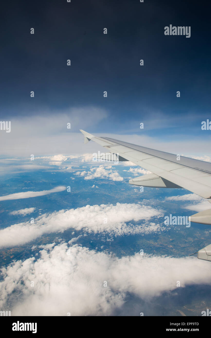 Airplane wing out of window Stock Photo - Alamy