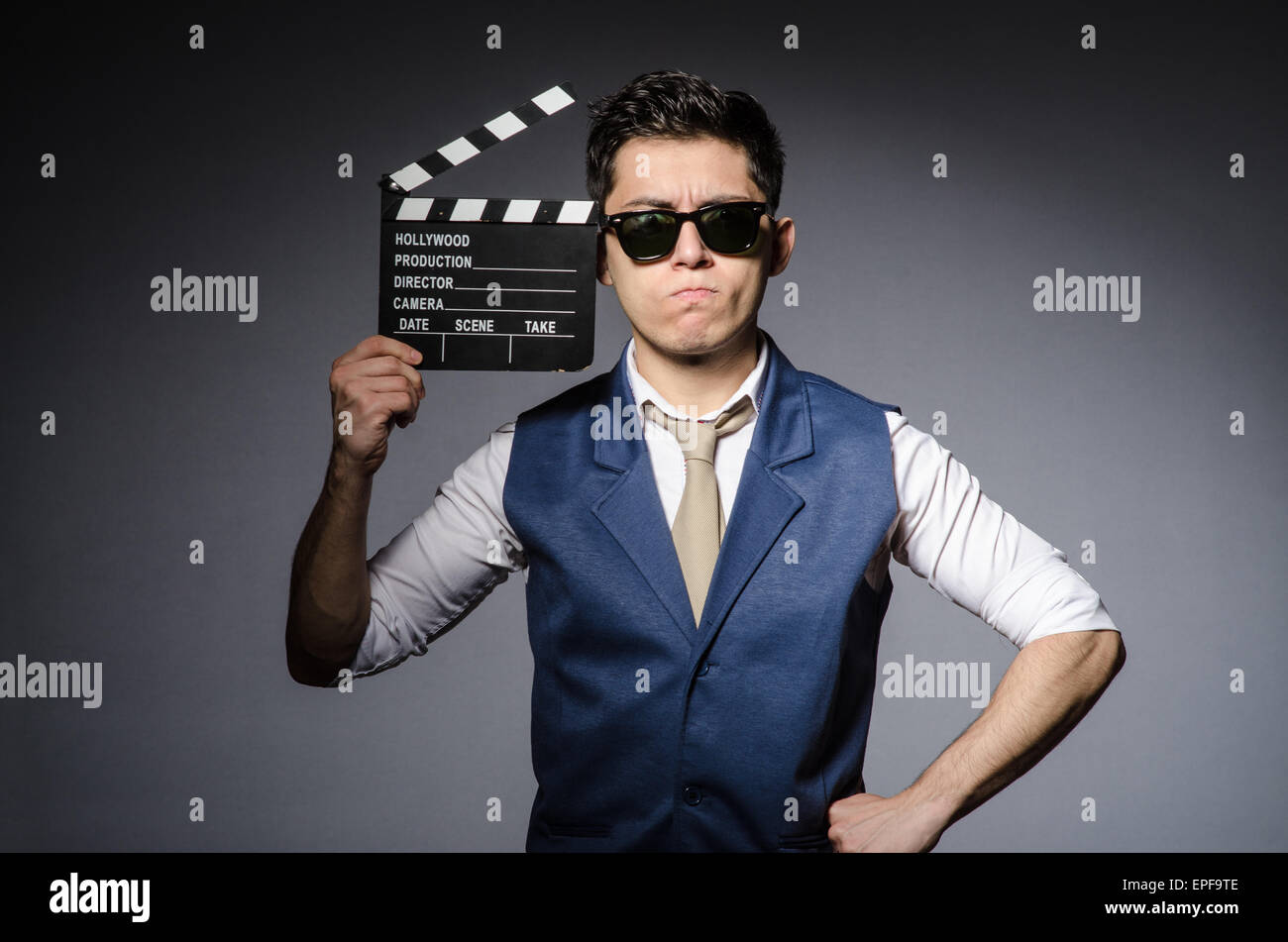Funny man with movie clapboard Stock Photo - Alamy