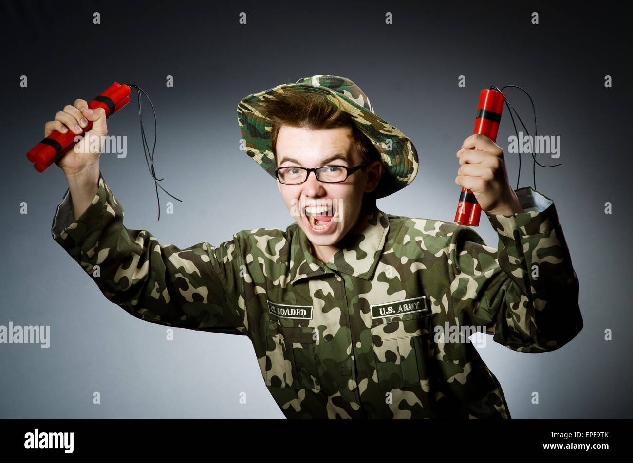 Funny soldier with red dynamite Stock Photo - Alamy