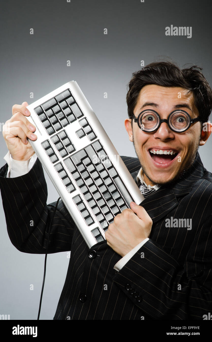Comouter geek with computer keyboard Stock Photo - Alamy