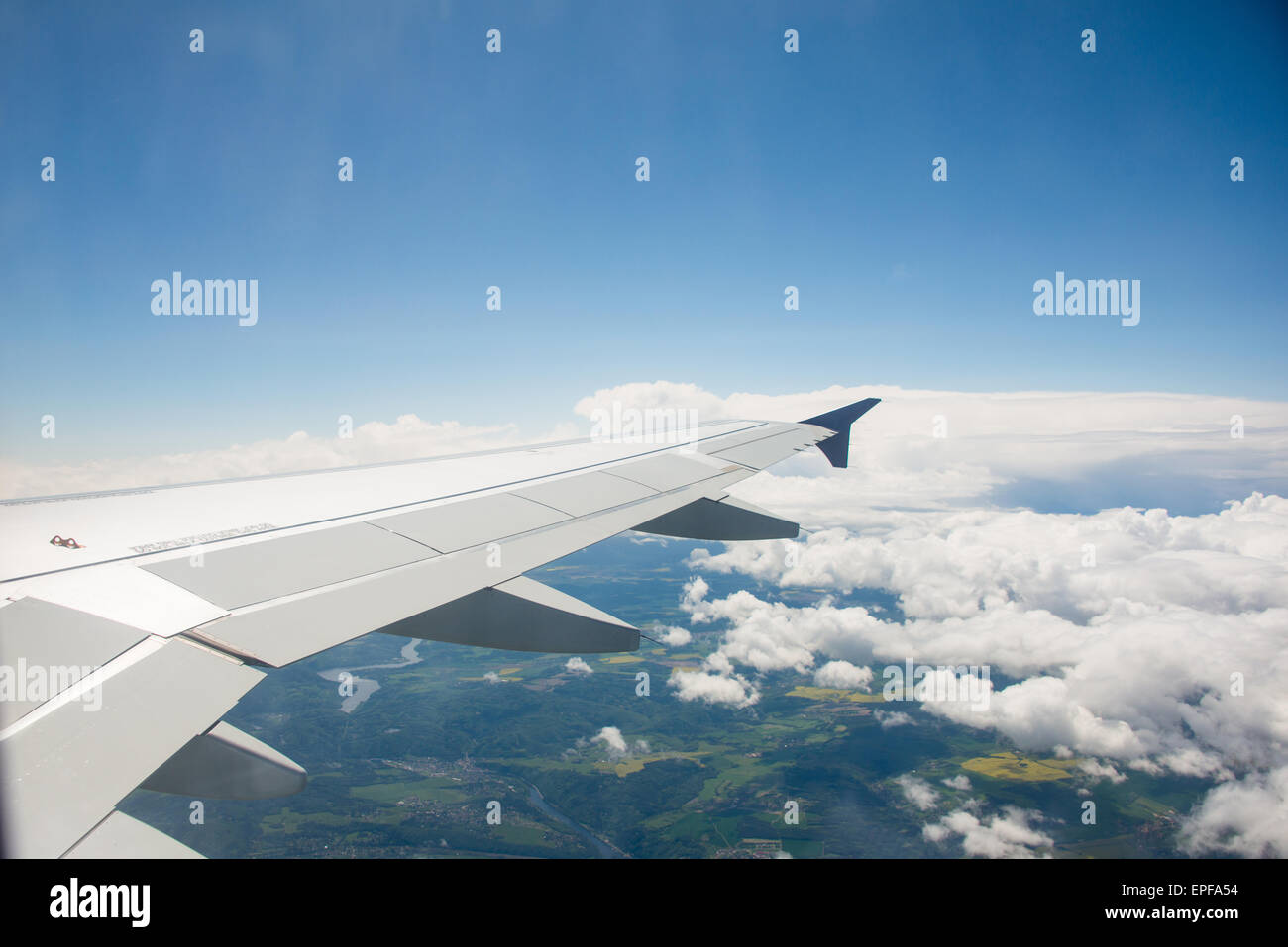 Airplane wing out of window Stock Photo - Alamy