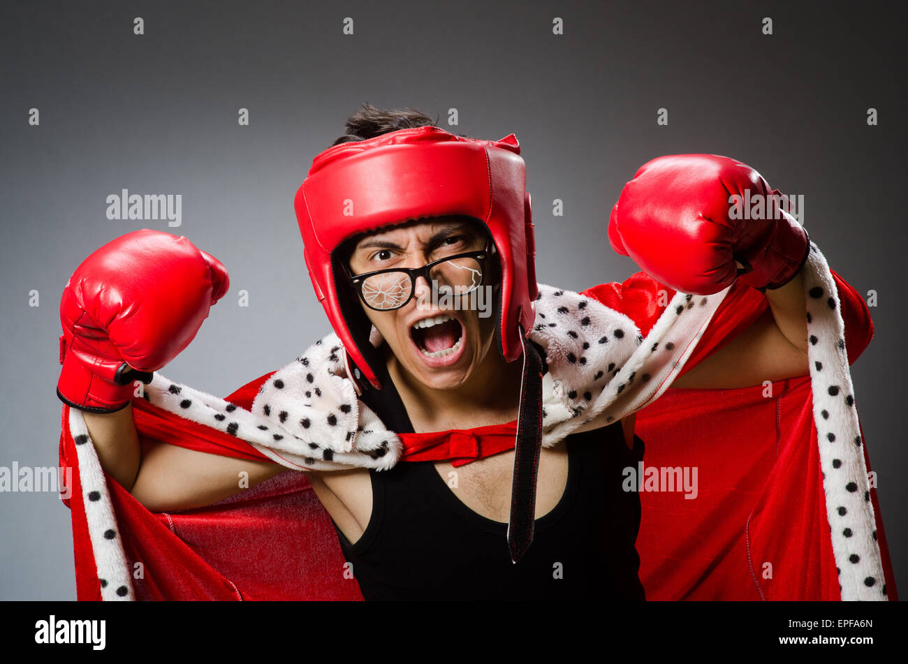 Funny boxer with red gloves against dark background Stock Photo - Alamy