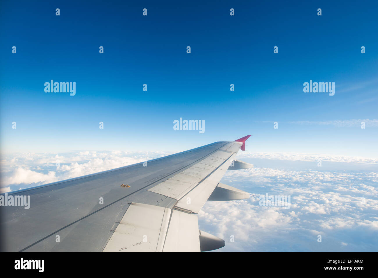 Airplane wing out of window Stock Photo - Alamy