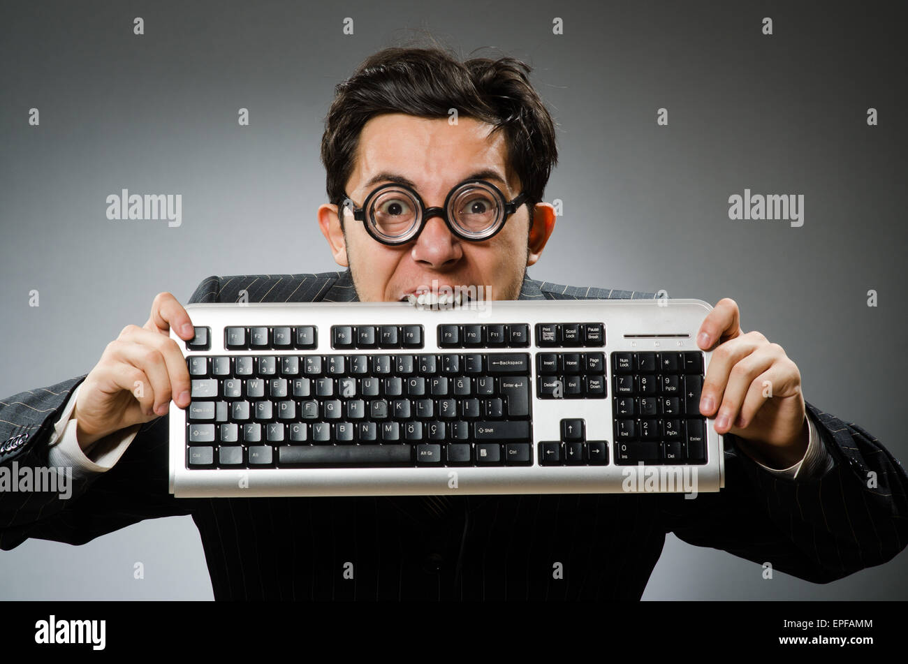 Comouter geek with computer keyboard Stock Photo - Alamy