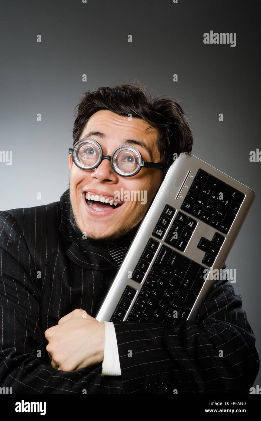 Comouter geek with computer keyboard Stock Photo - Alamy