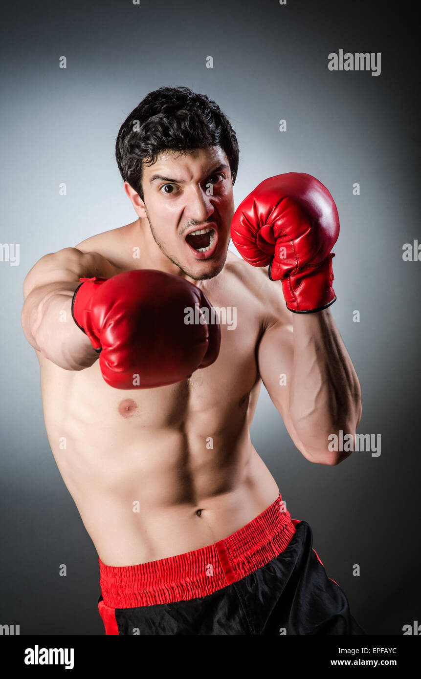 Muscular boxer wiith red gloves Stock Photo - Alamy