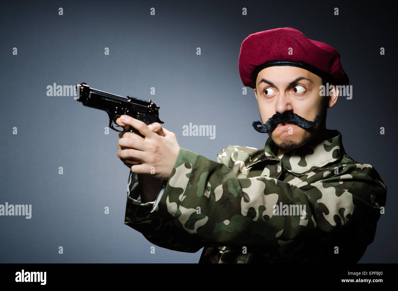 Funny soldier against the dark background Stock Photo - Alamy