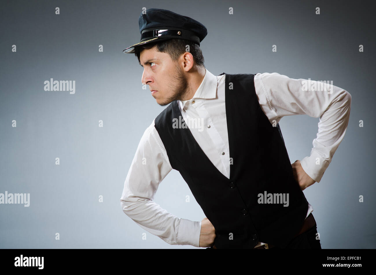 Funny taxi driver wearing peaked cap Stock Photo - Alamy