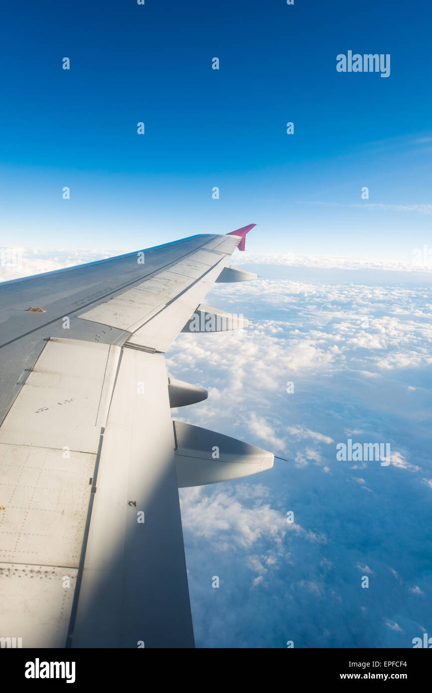 Airplane wing out of window Stock Photo - Alamy