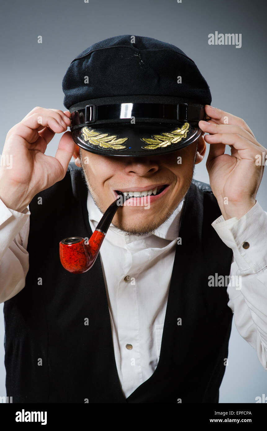 Captain smoking pipe with tobacco Stock Photo - Alamy