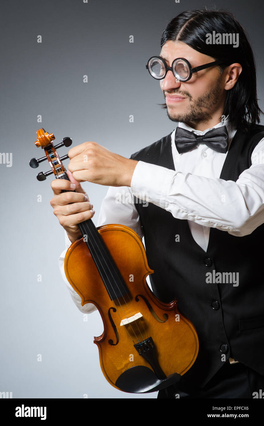 Funny fiddle violin player in musical concept Stock Photo - Alamy