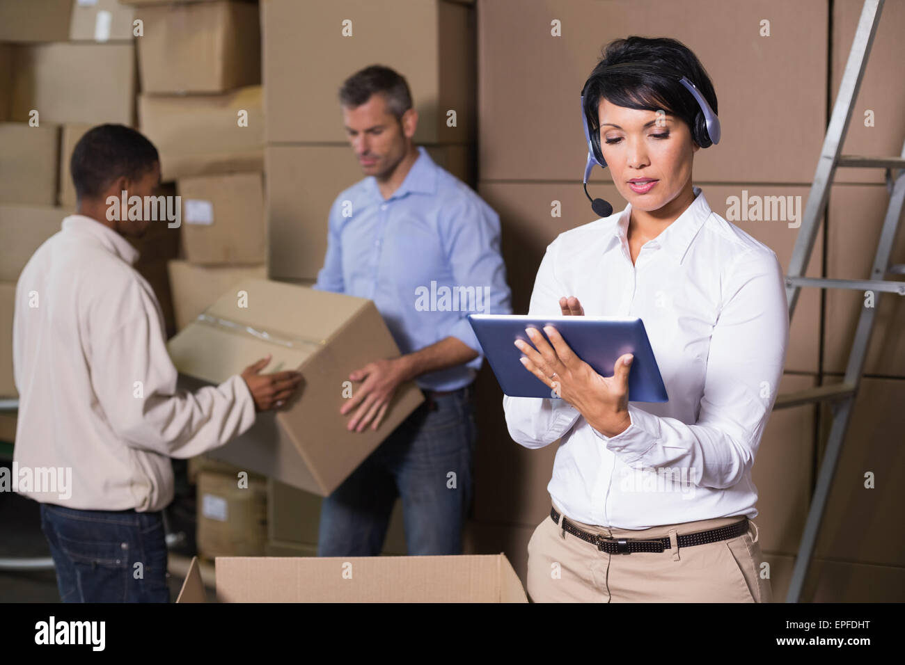 Young warehouse worker calling hi-res stock photography and images - Alamy
