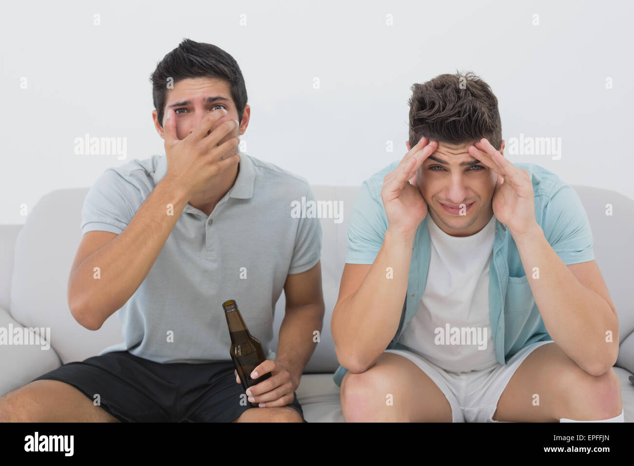 Depressed man watching tv hi-res stock photography and images - Alamy