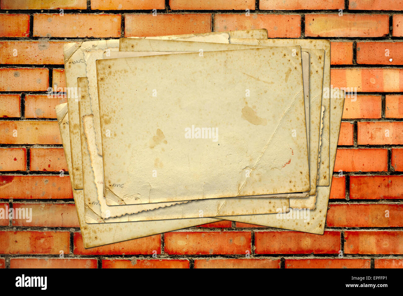 Set of old archival papers and vintage postcard on the brick background ...
