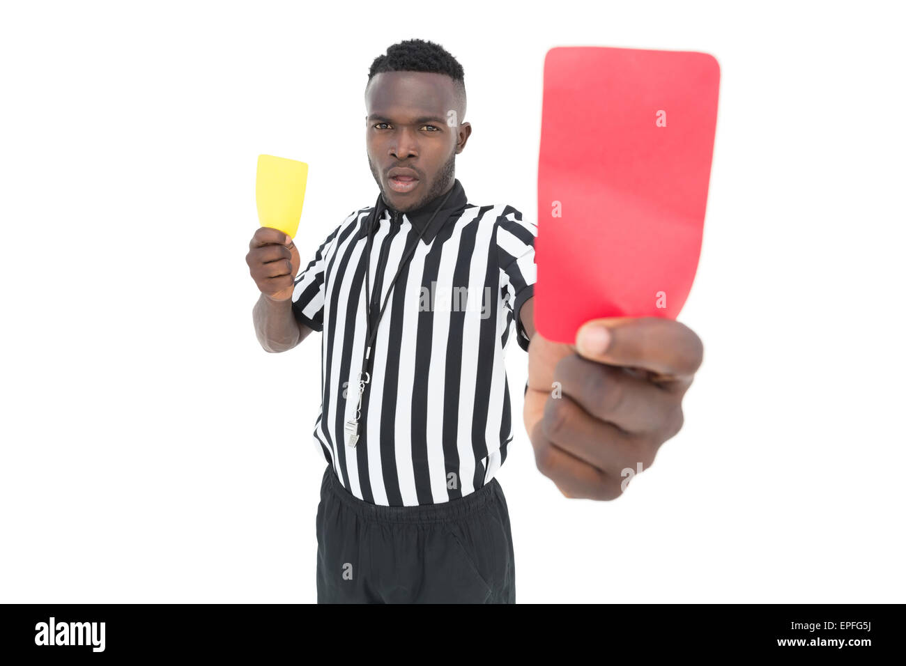 Serious referee showing yellow and red card Stock Photo - Alamy