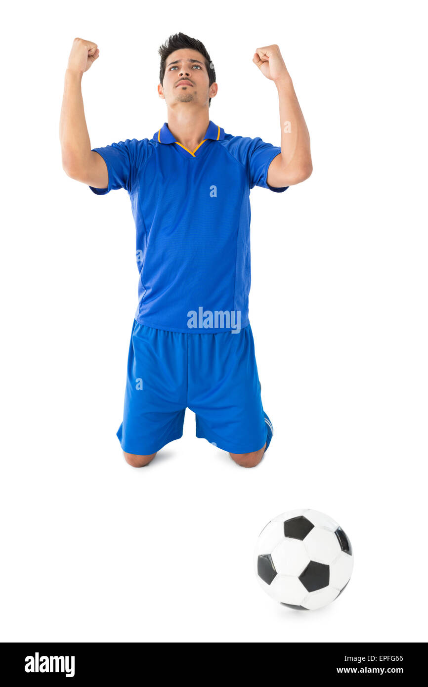Athletic football player cheering Stock Photo - Alamy