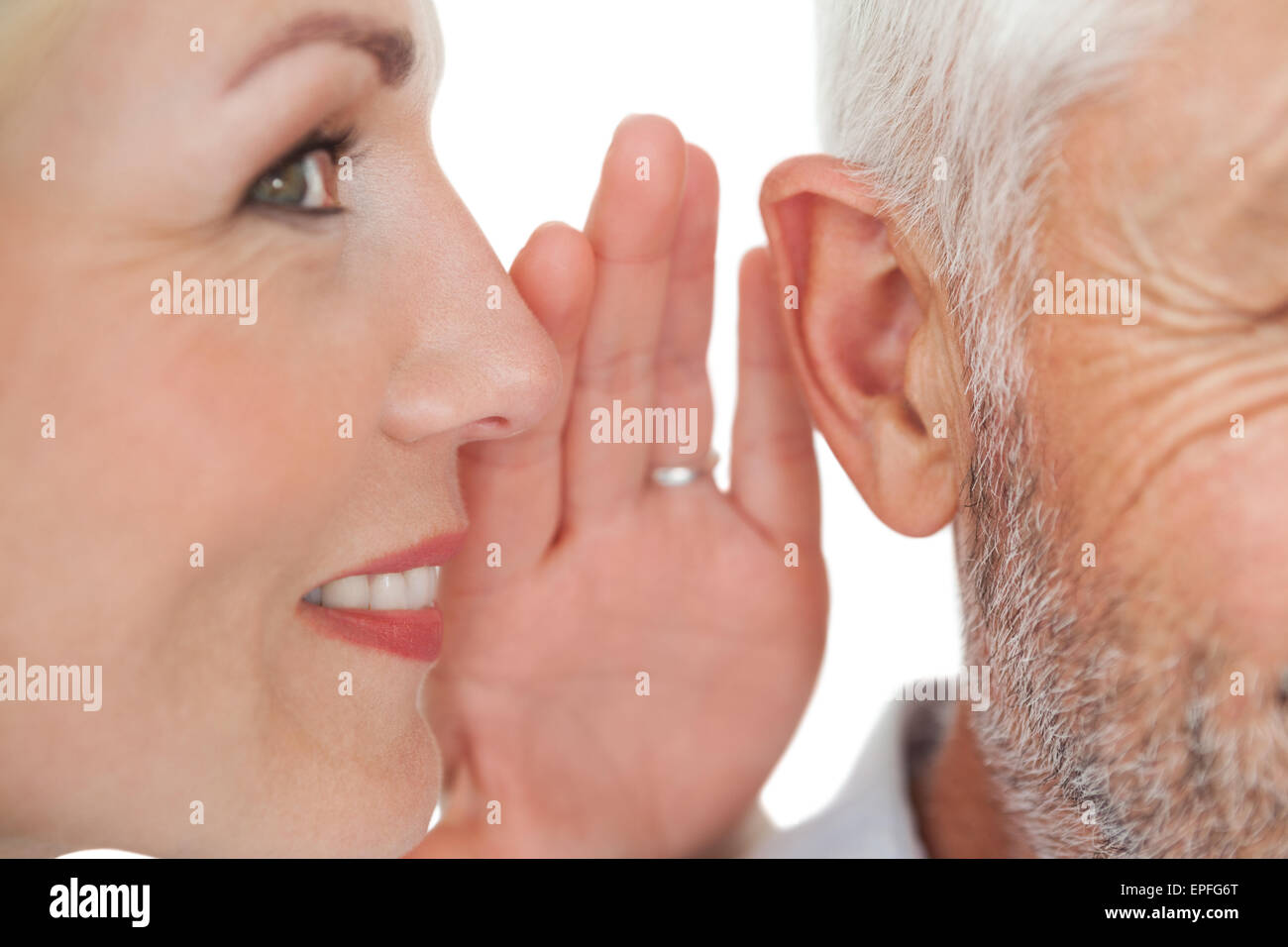 Telling a secret hi-res stock photography and images - Alamy