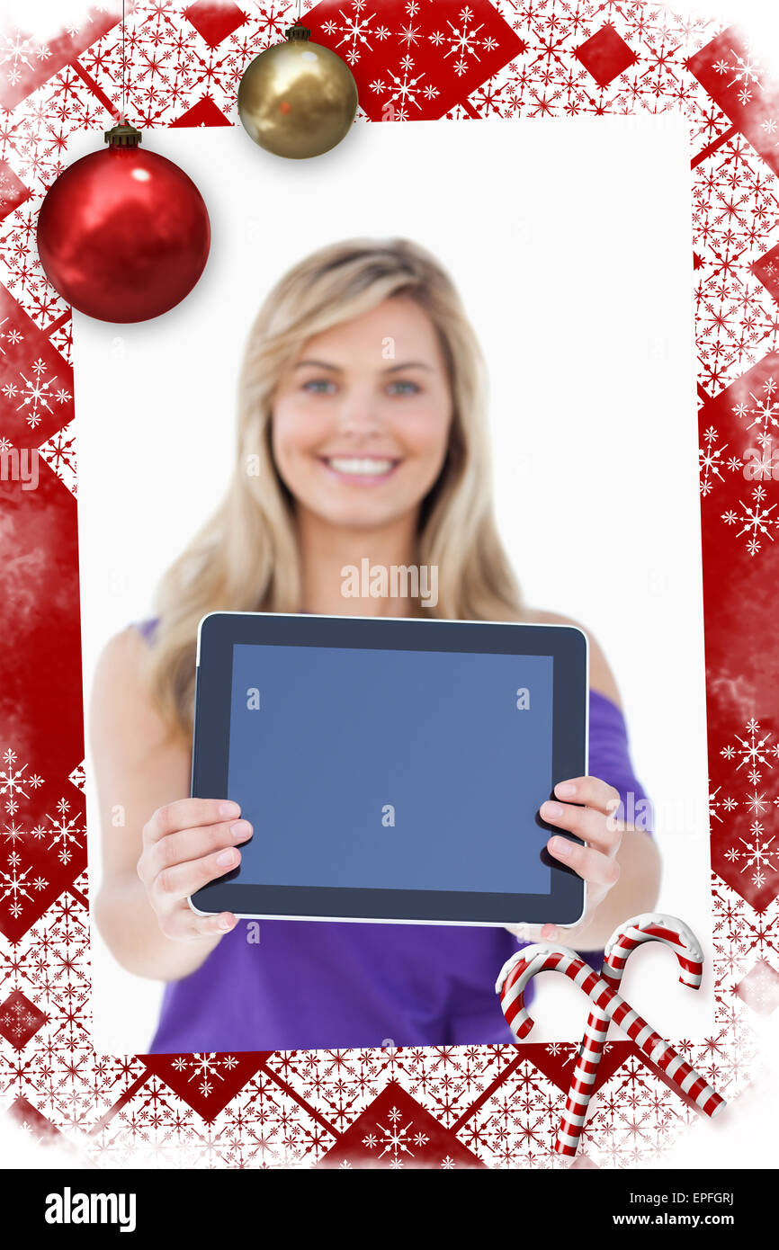 Composite image of tablet computer being held by a blonde woman Stock ...
