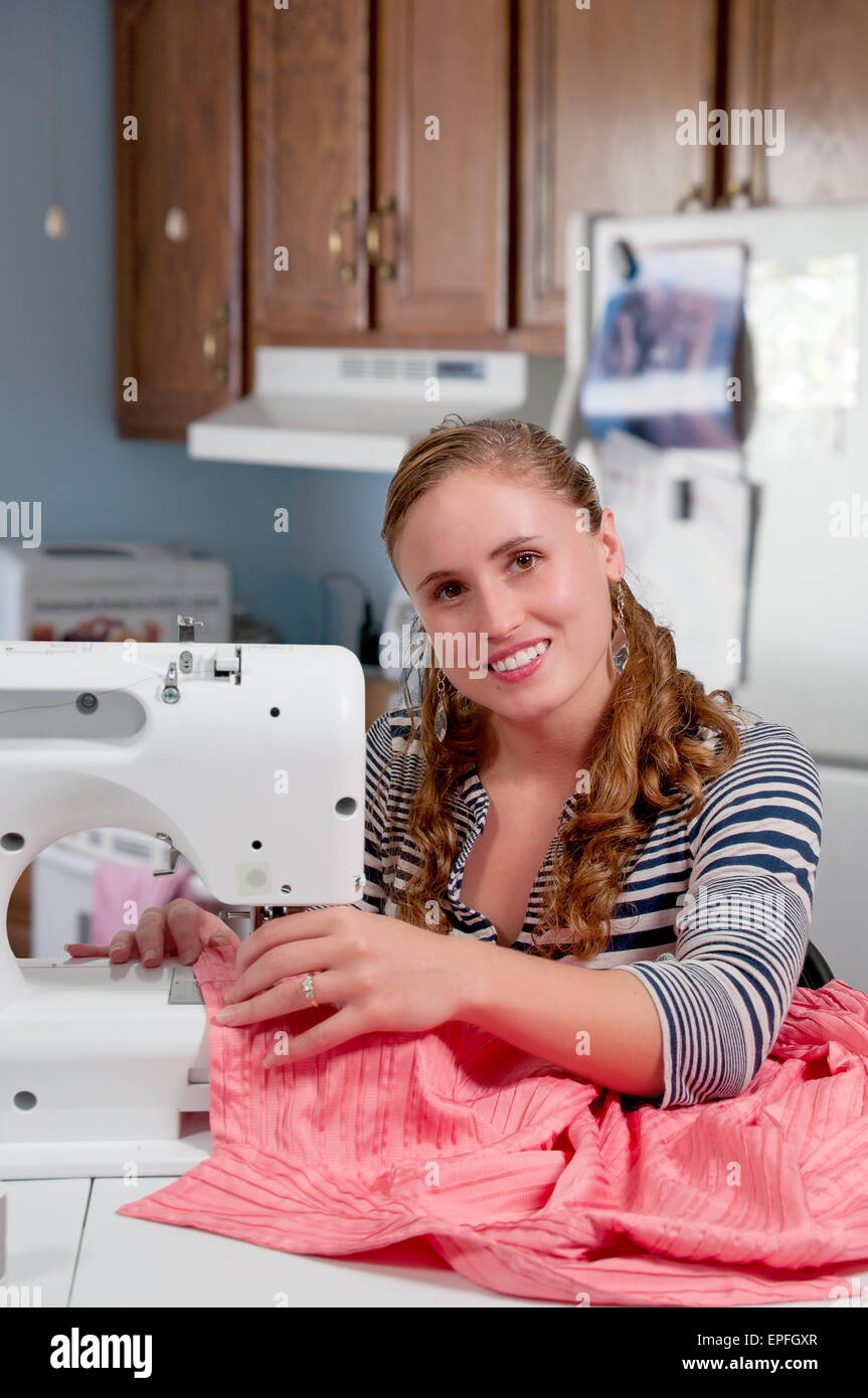 Female seamstress operating sewing machine hi-res stock photography and ...
