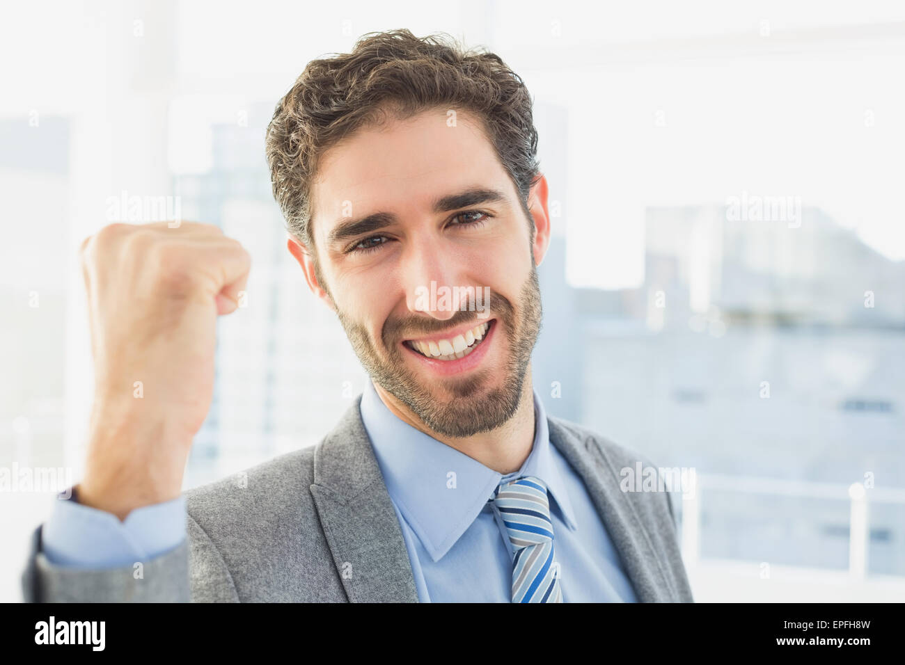 Businessman celebrating a good job Stock Photo - Alamy