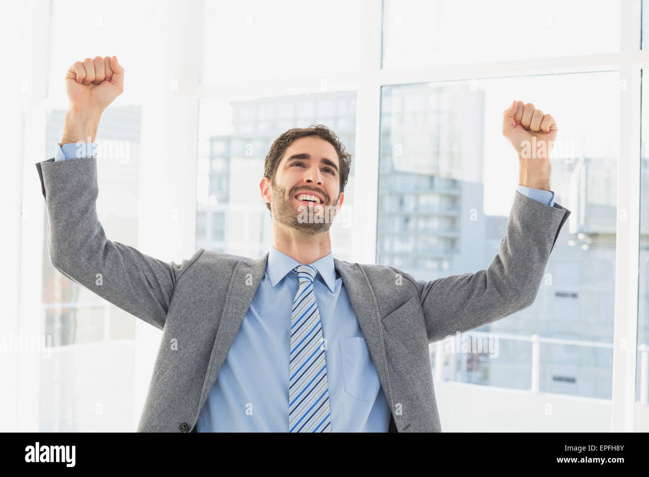 Businessman celebrating a good job Stock Photo - Alamy