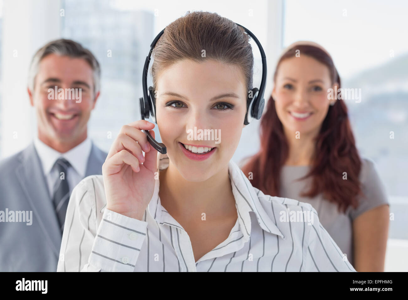 Businesswoman wearing a work headset Stock Photo - Alamy